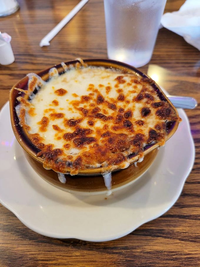 French onion soup with a cheese cap so perfect it deserves its own Instagram account. Spoon-breaking satisfaction guaranteed.