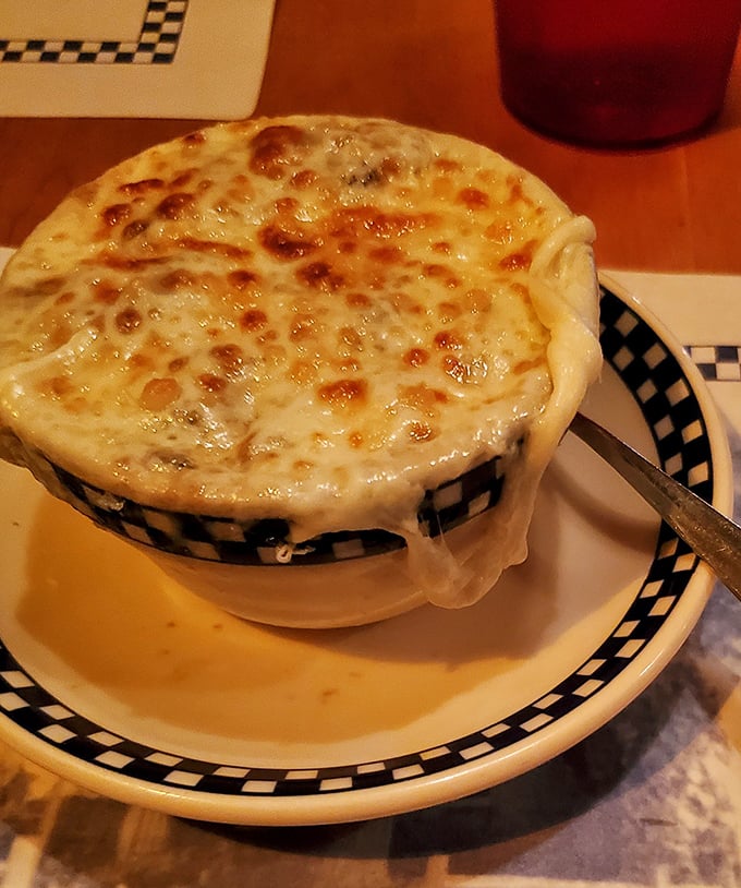 That stretchy cheese pull is performing an interpretive dance of dairy devotion &ndash; French onion soup that would make even Parisians nod in approval.
