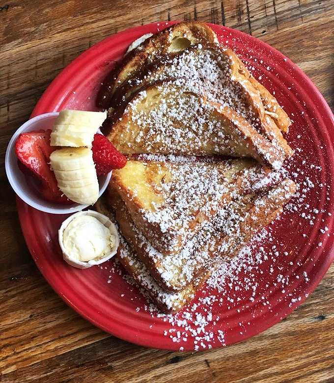 French toast that's dressed for success with a powdered sugar snowfall and fresh fruit entourage. Breakfast or dessert? The line deliciously blurs.