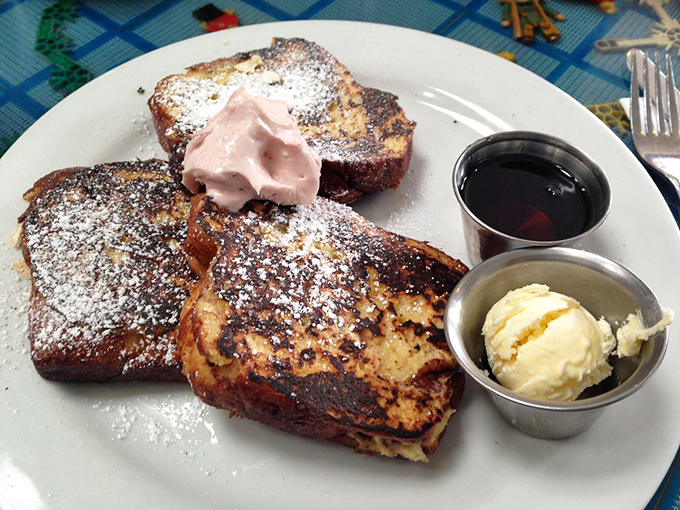 French toast that makes you wonder why you ever settled for lesser breakfast options. That whipped cream isn't just a topping&mdash;it's a statement.