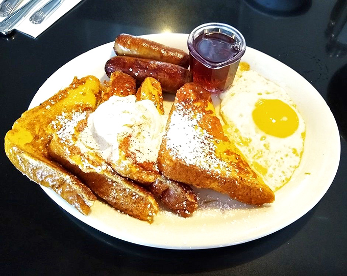 French toast that's achieved that magical balance between crispy exterior and custardy interior. The powdered sugar is just showing off.