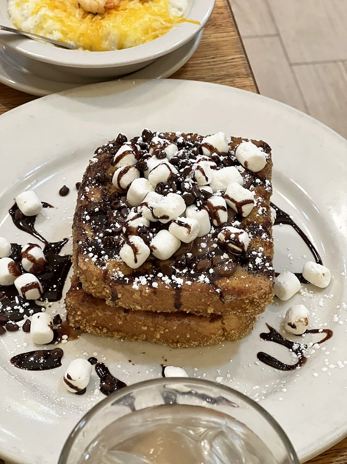 S'mores French toast that would make campfire enthusiasts weep with joy. Marshmallows never had it so good.