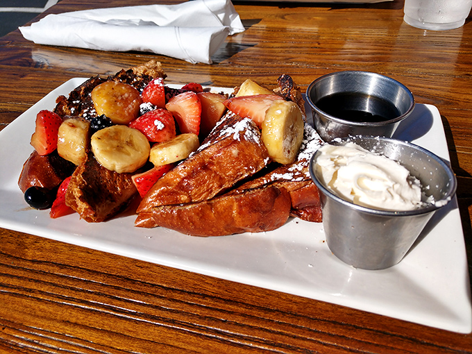 French toast that makes you wonder if breakfast is actually dessert in disguise, complete with fresh fruit and enough syrup to swim in.