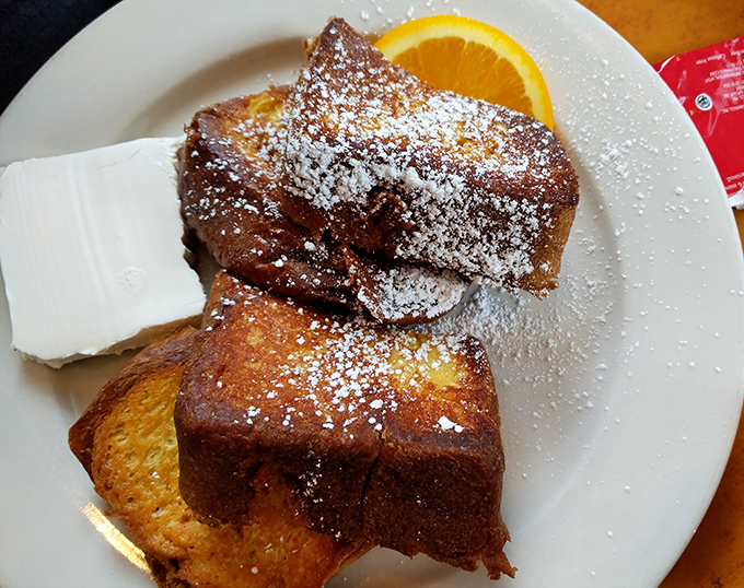 French toast that's dressed for success with powdered sugar snow and a citrus garnish. Breakfast or dessert? Why choose when you can have both?