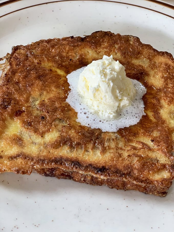 French toast transformed into golden perfection, proving that simple ingredients can create extraordinary breakfast experiences.