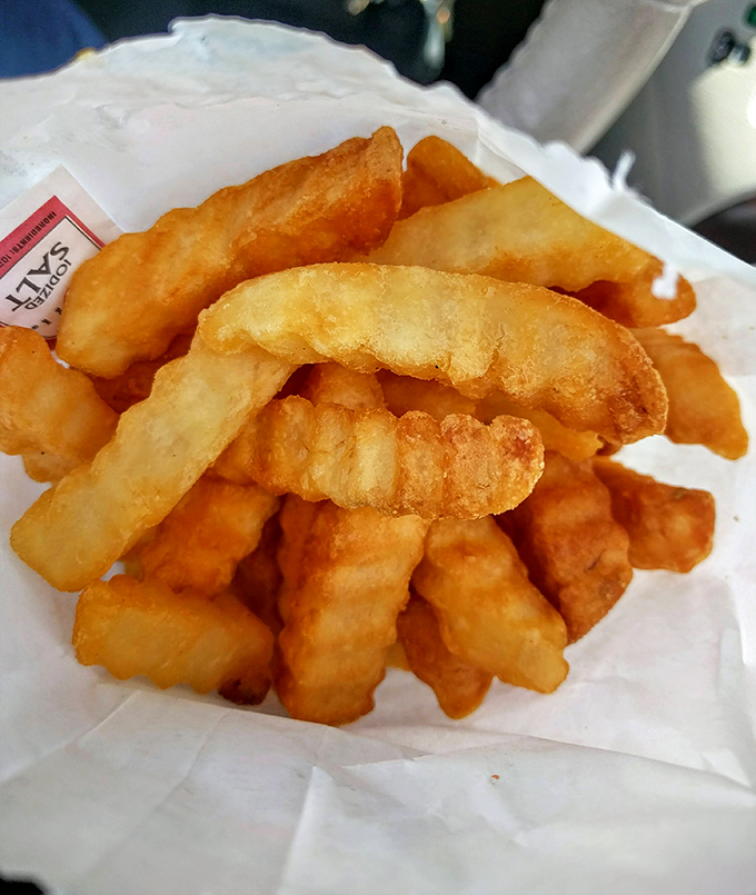 French fries that achieve the golden ratio of crispy exterior and fluffy interior—the kind that make you forget fancy dining exists.