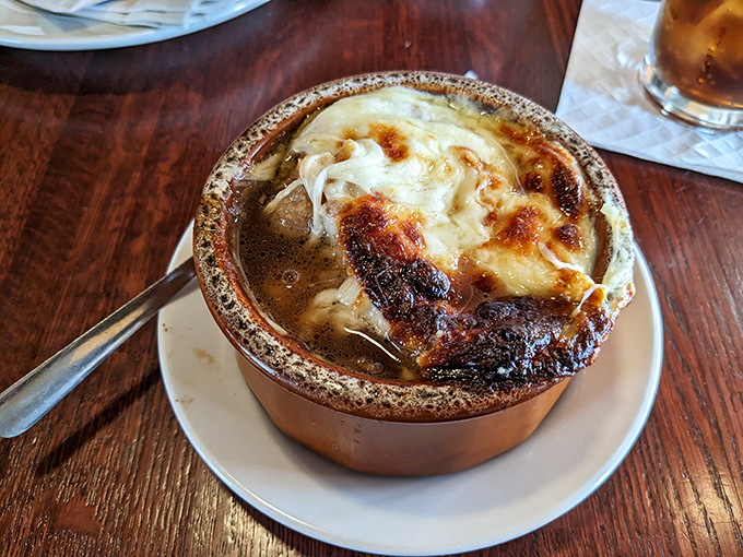 This French onion soup isn't just topped with cheese &ndash; it's wearing a magnificent crown of broiled provolone that's practically begging to be photographed.