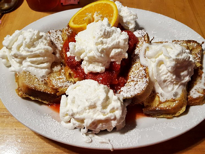 French toast that's dressed for success with strawberries, whipped cream, and enough visual appeal to make your Instagram followers weep with envy.