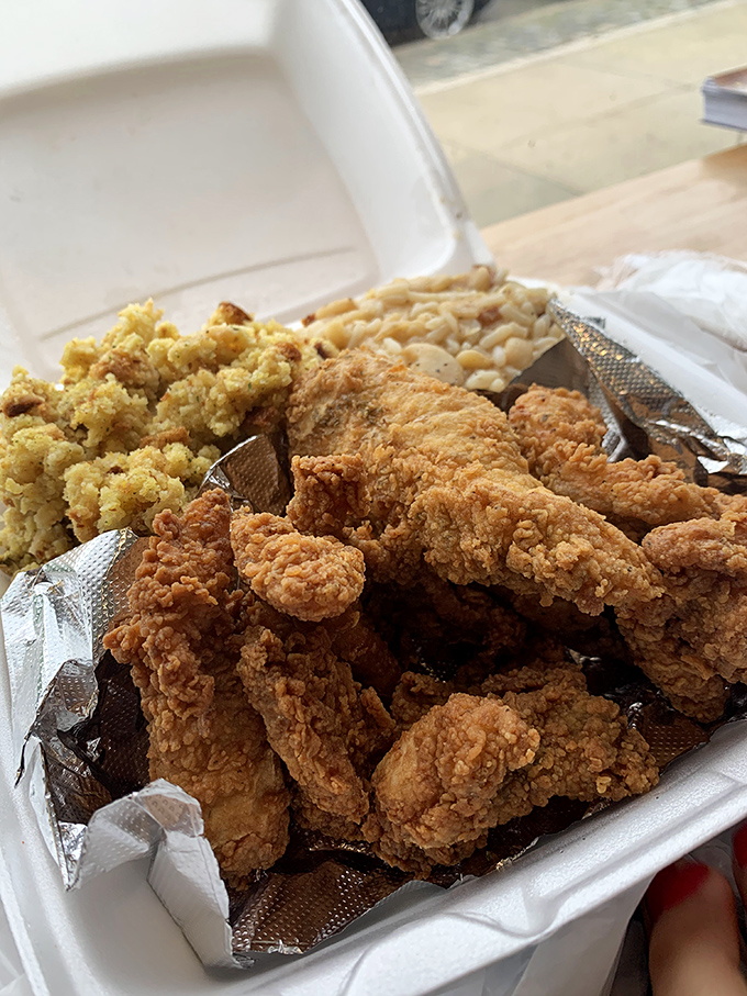 Fried chicken so perfectly golden it belongs in Fort Knox. Paired with cornbread stuffing and mac and cheese, it's the comfort food trifecta.