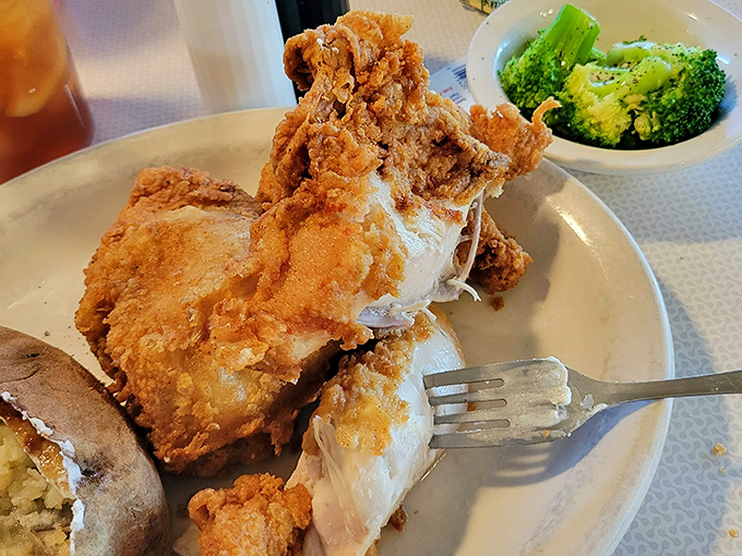 Fried chicken that would make Colonel Sanders weep with jealousy, paired with vibrant broccoli in a classic "balance" of indulgence.