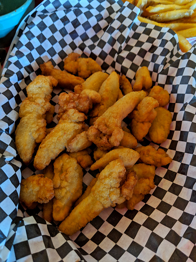 Golden fried clams that look like tiny treasure nuggets from the sea, crispy outside and tender within &ndash; pure perfection.