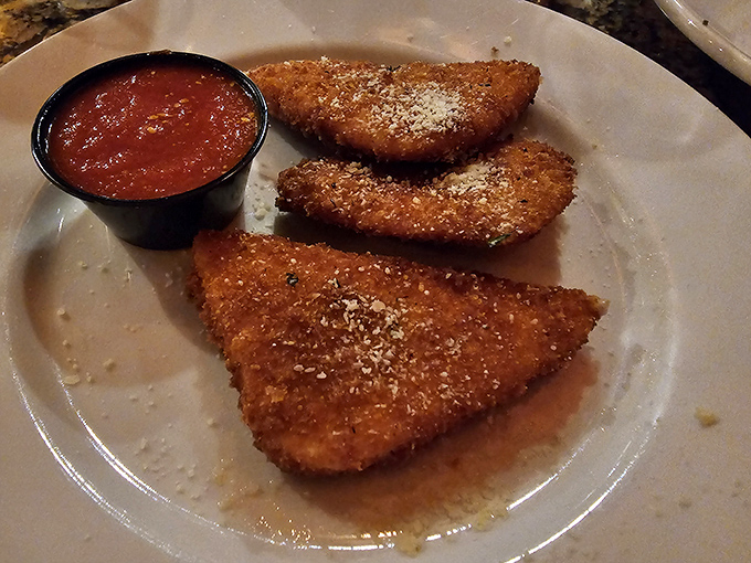 These triangles of fried mozzarella aren't just appetizers&mdash;they're crispy vessels delivering molten cheese happiness straight to your soul.