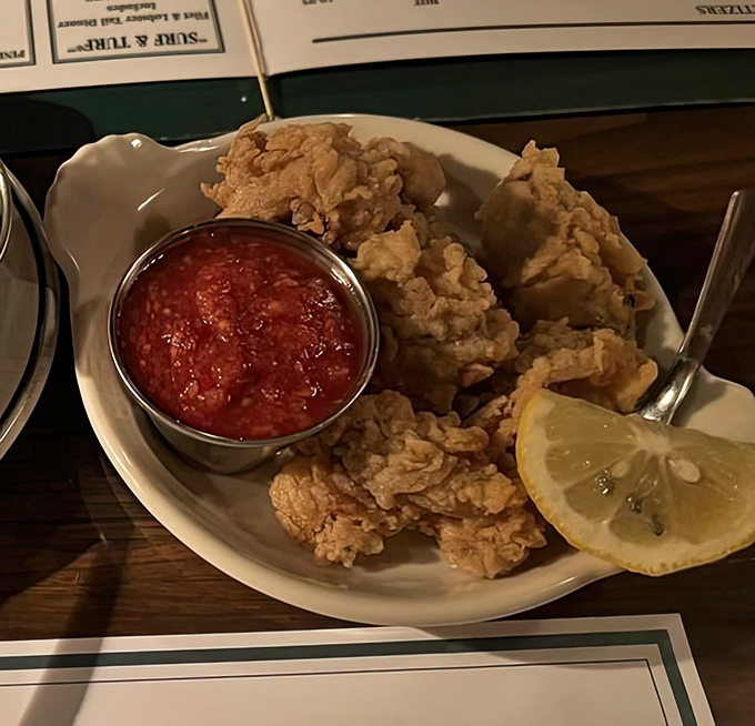 Golden-fried oysters that crunch like autumn leaves. The cocktail sauce brings just enough heat to make things interesting without starting a fire.