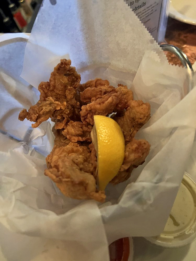 Fried oysters done right &ndash; crispy armor protecting briny treasures within, with that lemon wedge standing by for its supporting role.