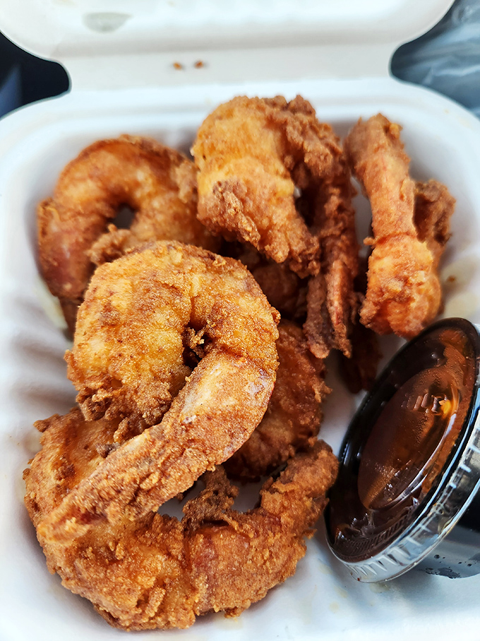 These golden-battered shrimp are the ocean's gift to the deep fryer. Plump and perfectly cooked with a dipping sauce that demands to be sampled.