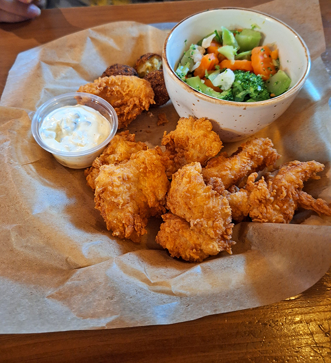 Golden-fried perfection meets fresh vegetables&mdash;proof that balance in life is possible, even when one side is deliciously battered and crispy.