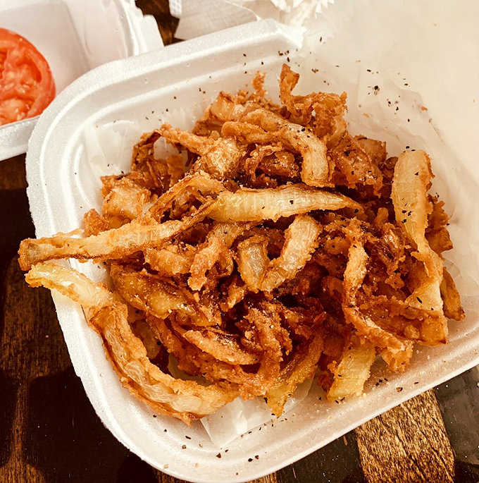 These aren't just onion rings; they're crispy, golden halos of happiness that make the perfect sidekick to your burger adventure.