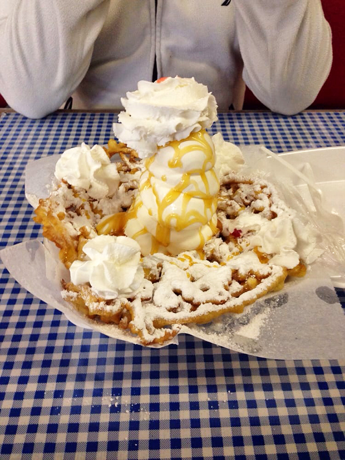 The ultimate funnel cake experience: crispy, powdery perfection topped with vanilla ice cream and caramel that drips like liquid gold. Diet starts tomorrow.
