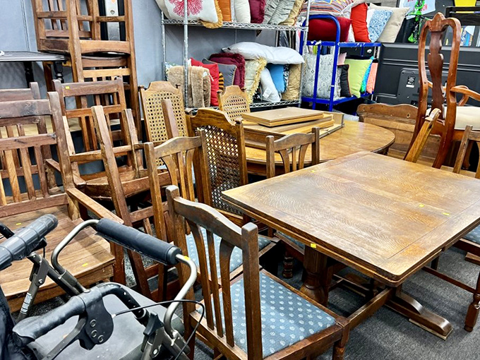 Wooden furniture gathering for what looks like the world's most eclectic dinner party, mismatched chairs celebrating their glorious differences.