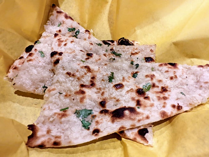 Garlic naan: the unsung hero of every Indian meal and the perfect edible utensil for sauce reconnaissance missions.