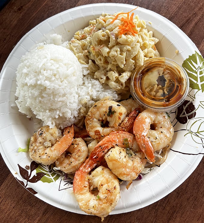 Plump, glistening garlic shrimp alongside mac salad and rice &ndash; the holy trinity of Hawaiian plate lunch perfection.
