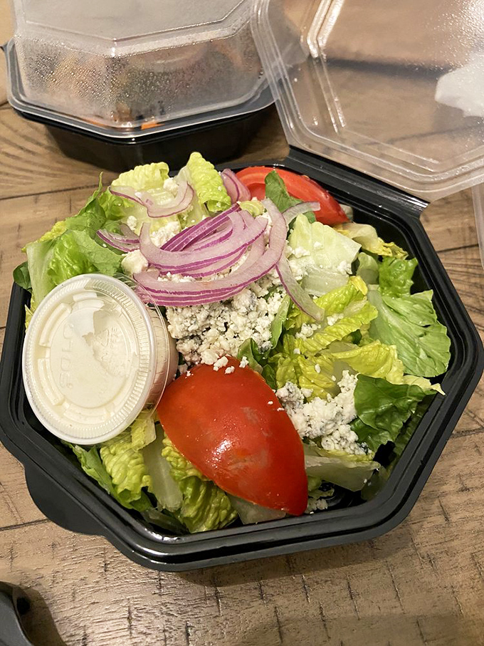 A salad that actually excites&mdash;crisp romaine, tangy blue cheese, and red onions sharp enough to cut through your pre-dinner hunger pangs.