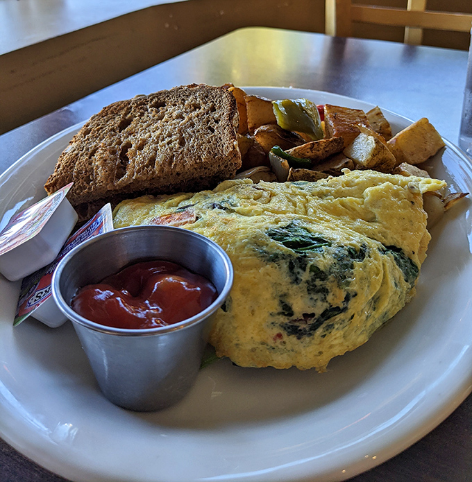 This isn't just an omelet &ndash; it's architecture, engineering, and art all on one plate, with toast standing by for support.