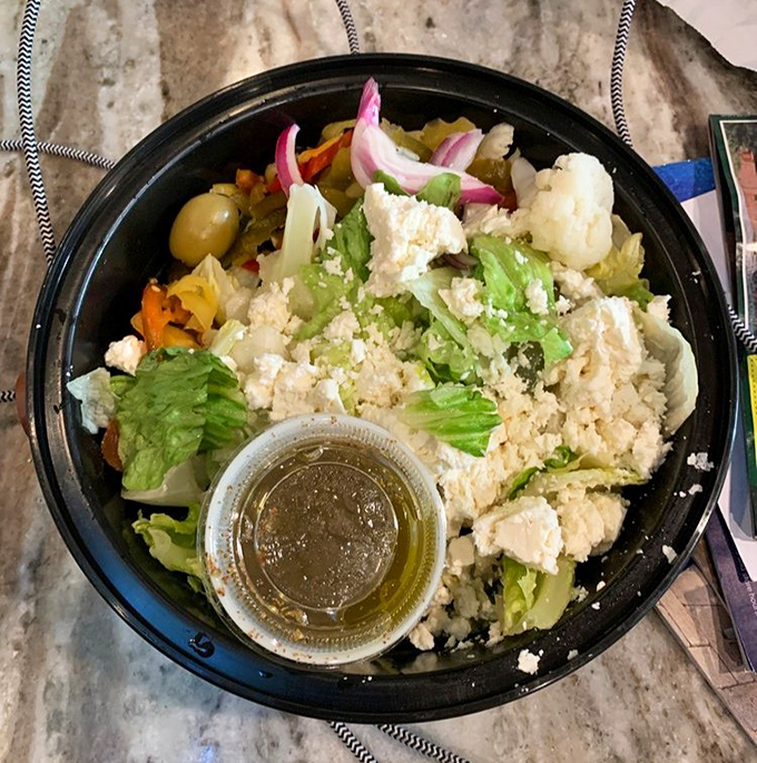 A Greek salad that brings Mediterranean freshness to Pennsylvania, complete with generous feta crumbles and that golden olive oil drizzle.