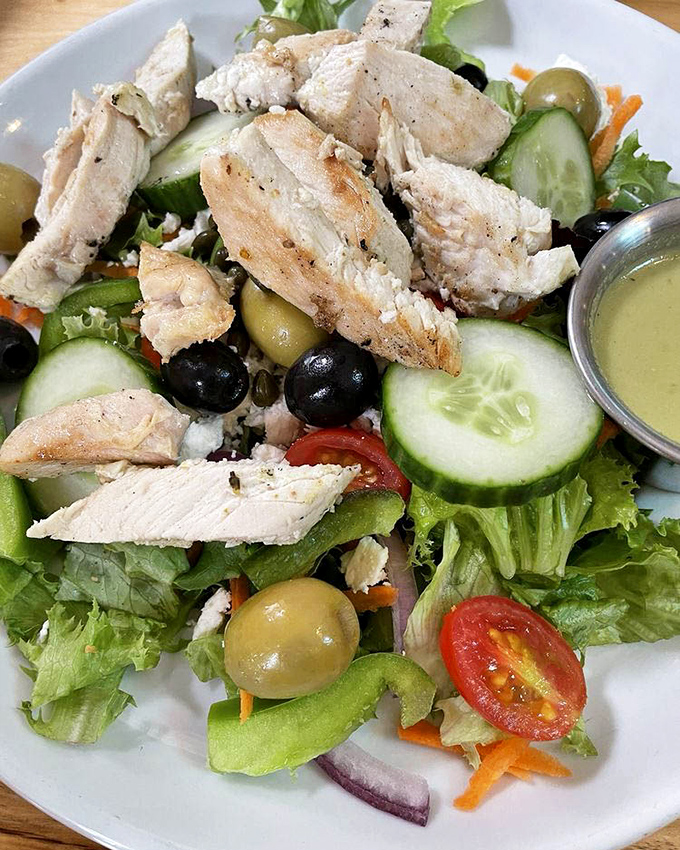 A Greek salad that respects both tradition and the chicken that gave its life for it&mdash;olives and feta playing supporting roles to perfectly seasoned protein.