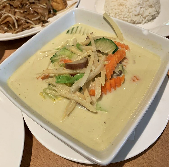 A bowl of green curry that could make even the most stoic Pennsylvanian shed a tear of joy. Vegetables swimming in liquid gold.