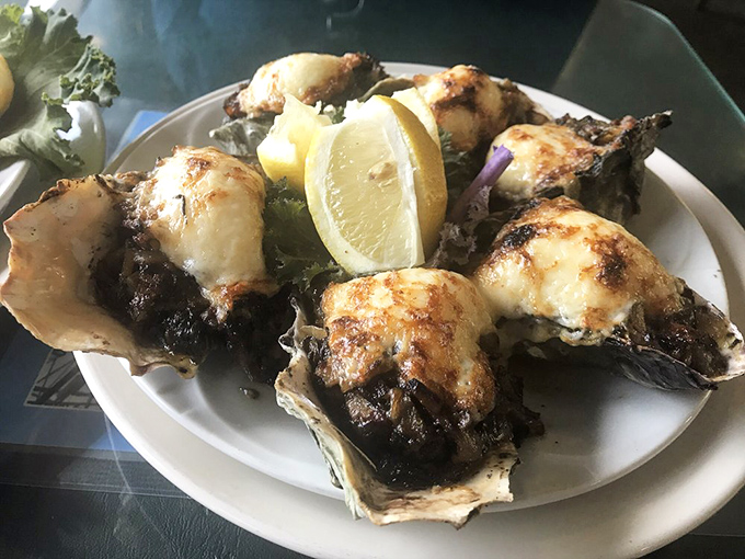 Oysters wearing a blanket of melted cheese and herbs &ndash; proof that sometimes playing with perfection actually makes it better. Sea-to-mouth happiness.