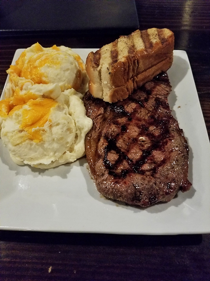 When your steak arrives with twice-baked potatoes sporting a golden cheese crown, it's like the royal family of comfort food has arrived.