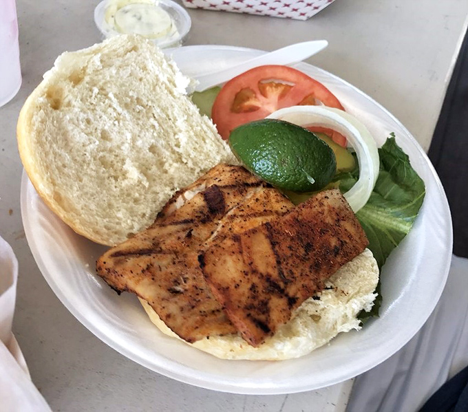 A perfectly grilled grouper sandwich that makes you wonder why anyone bothers with burgers when this exists.