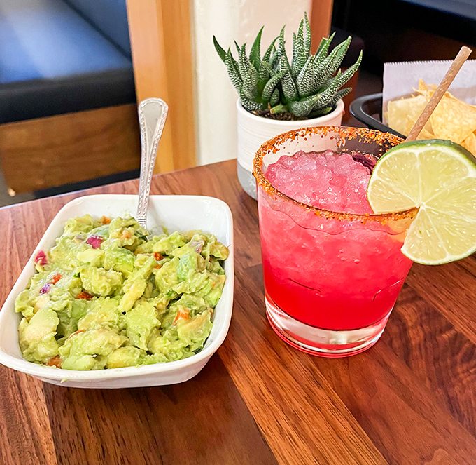 Fresh guacamole that practically screams "I was an avocado this morning!" paired with a cocktail the color of an Arizona sunset.