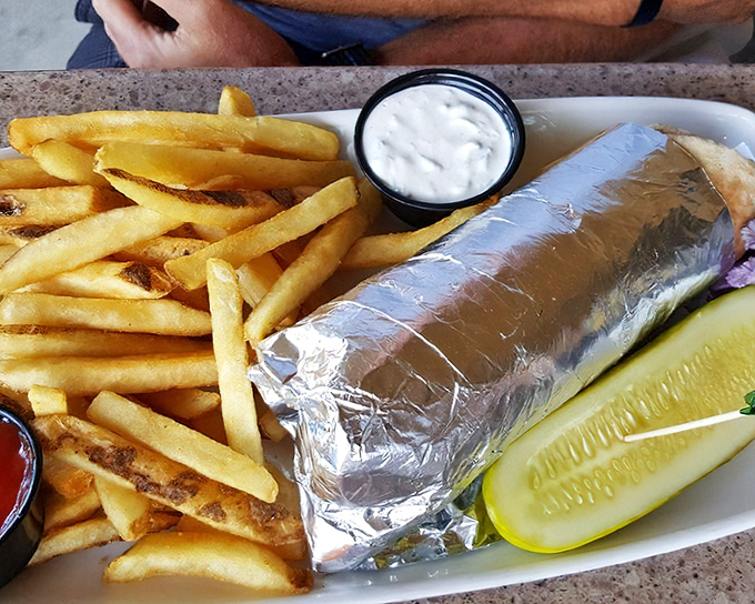 When a sandwich needs to wear a foil tuxedo, you know you're in for something special. Those fries aren't just sides&mdash;they're co-stars.