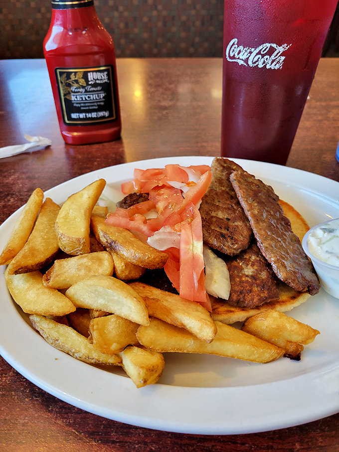 When a sandwich means business: hearty meat, garden-fresh tomatoes, and steak fries that could make a potato farmer weep with pride.