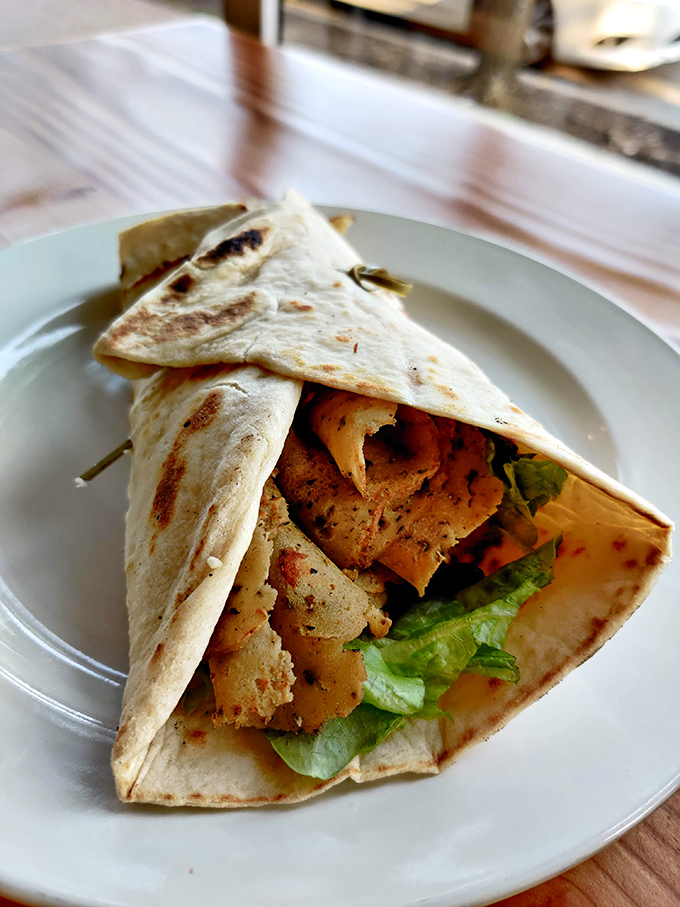 Their plant-based gyro wraps Mediterranean flavors in a warm embrace that transports you straight to Athens.