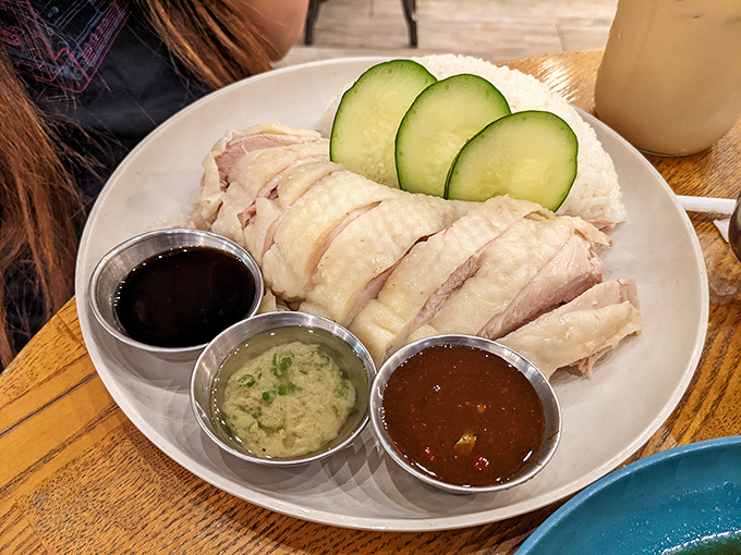 Hainan chicken so perfectly poached it practically preens on the plate, accompanied by a trio of sauces for your dipping pleasure.