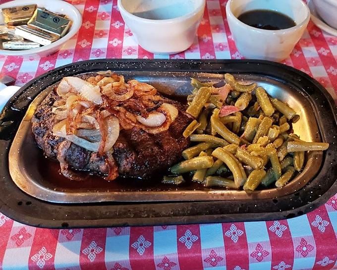 A hamburger steak topped with saut&eacute;ed onions that doesn't need fancy aioli or artisanal anything&mdash;just green beans and your undivided attention. 
