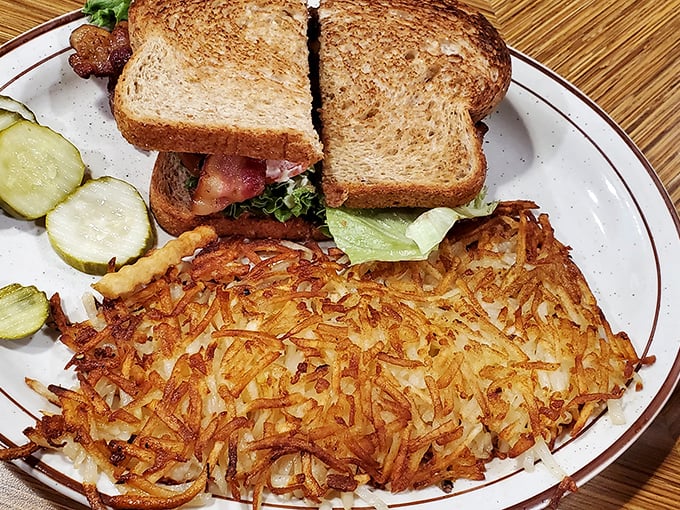Hash browns achieving the golden-brown perfection that home cooks dream about but rarely accomplish.