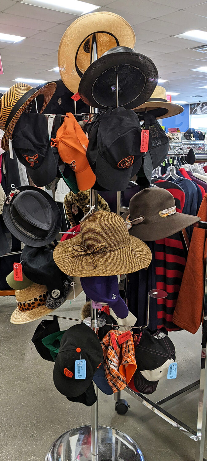 Hat heaven! From baseball caps to sun hats, each one carrying stories of vacations, sporting events, and fashion statements past.