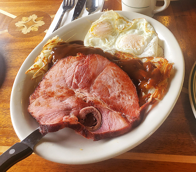 Ham steak that means business, eggs sunny-side up, and hashbrowns with the perfect crisp&mdash;this is breakfast that fuels adventures or justifies naps.