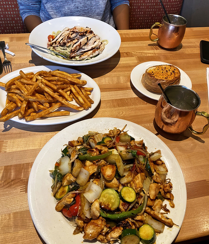 A feast fit for royalty&mdash;or just really hungry humans. Stir-fried chicken with vegetables, pasta with grilled chicken, and golden fries that demand attention.