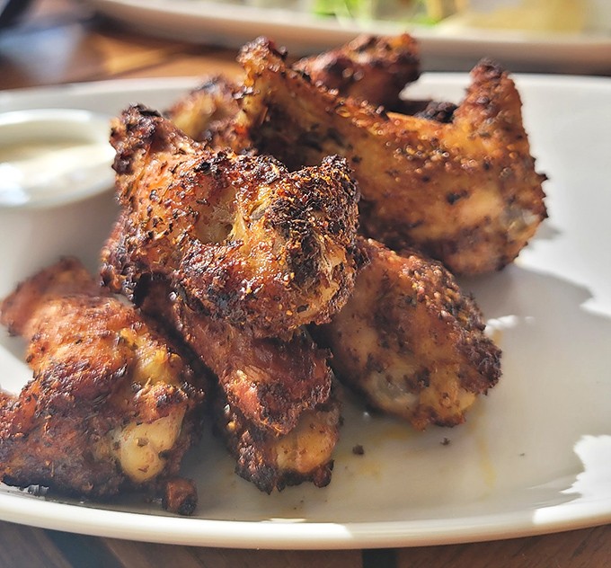 These aren't just wings&mdash;they're flavor bombs with a perfect char that would make any backyard grillmaster secretly take notes between bites.
