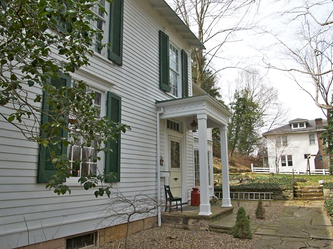 Classic white clapboard with green shutters&mdash;the architectural equivalent of comfort food. This historic home embodies the gracious hospitality that defines river town living.