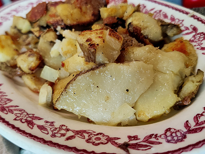 These home fries deserve their own fan club&mdash;crispy edges, tender centers, and seasoned with what can only be decades of griddle wisdom and a touch of diner magic.