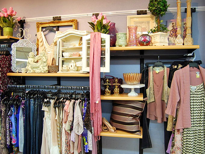 Where shabby meets chic. Pink scarves cascade next to delicate china cabinets, creating a boutique feel that belies the thrift store prices.