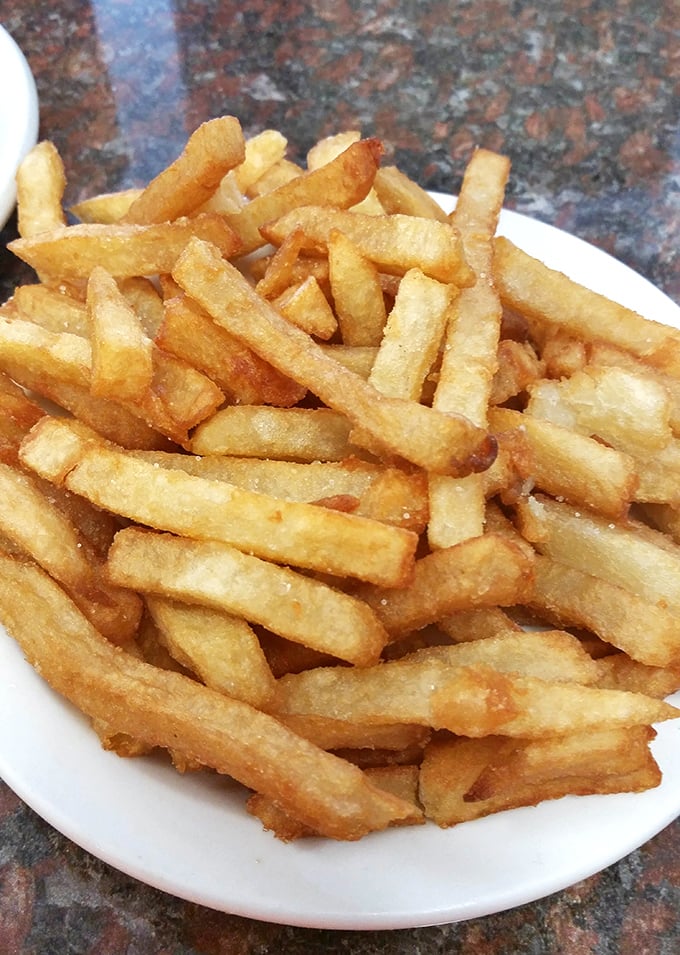 Home fries that achieve the impossible trifecta: crispy edges, tender centers, and seasoning that makes salt shakers feel neglected.