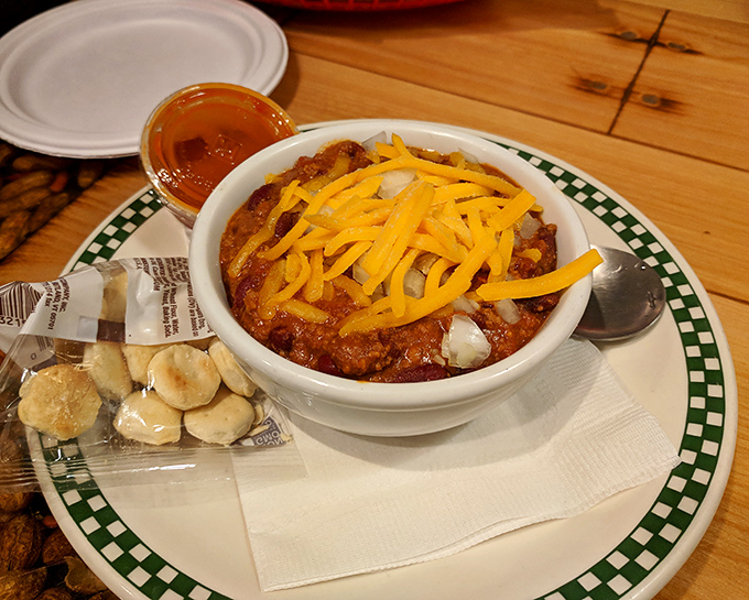A bowl of homemade chili topped with cheese—comfort food that hugs you from the inside out on those brutal Illinois winter days.