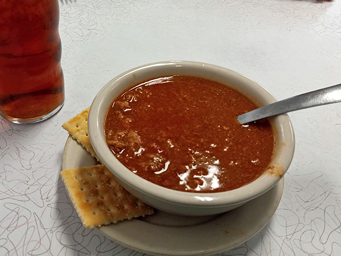 Homemade chili served with crackers: comfort food that warms you from the inside out, spoonful by satisfying spoonful of happiness.
